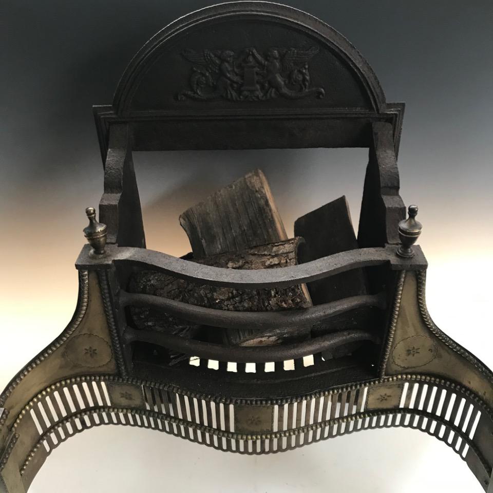 THOMAS ELSLEY CAST IRON AND BRASS ADAMS FIRE GRATE, CIRA 1890